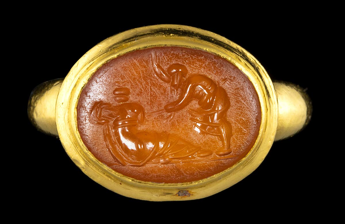 A ROMAN CARNELIAN INTAGLIO SET IN A MODERN GOLD ... - Bertolami Fine Art